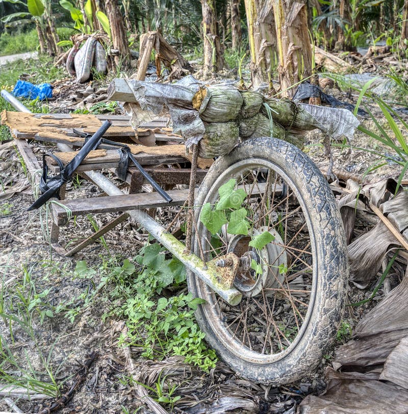 An Old Rusted Trolley with Motorcycle Wheel Stock Photo - Image of ...