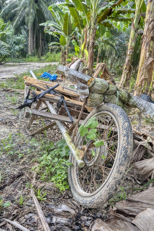 An Old Rusted Trolley with Motorcycle Wheel Stock Image - Image of farm ...