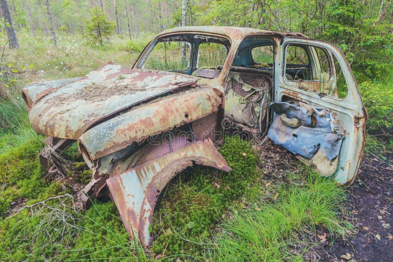 Old Rusted Scrap Car in a Forest Stock Photo - Image of decay ...