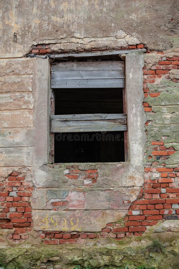 Old Rustic Boarded Up Window on the Ancient Abandoned Brick House Stock ...