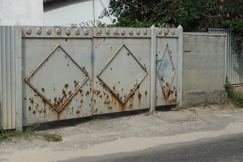 Old Rustic Iron Gate in Brown Rust on the Street Stock Photo - Image of ...