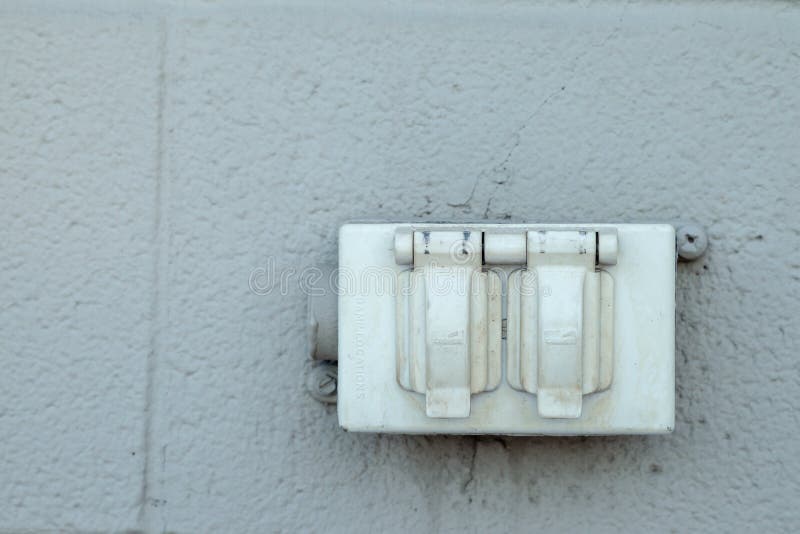 Old Rustic North American Electrical Outlet on a Exterior Brick Wall ...