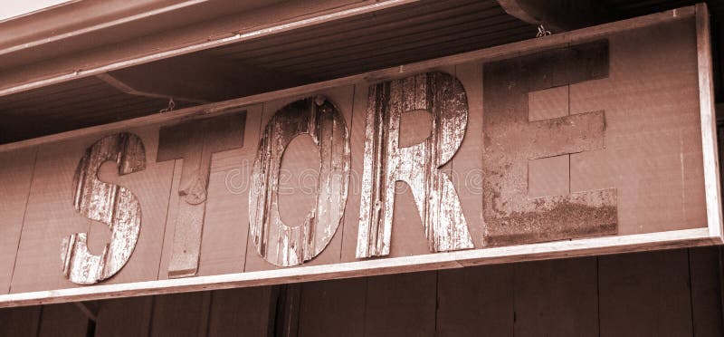 Old Rustic Store Sign Hanging, Letters Eroding and Rusted Stock Image ...