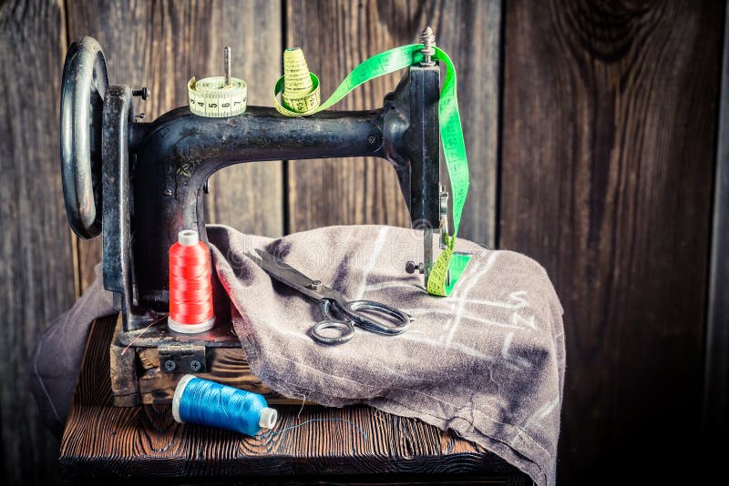 Old and Rustic Tailor Machine with Threads, Scissors and Cloth Stock ...