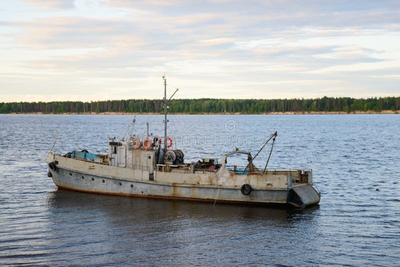 An Old Rusting Ship Stands by the Waters Stock Photo - Image of river ...
