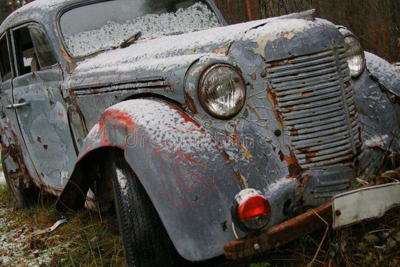Old Rusty Abandoned Car in the Forest. Lost Old Russian Auto Stock ...