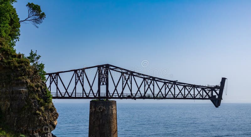 Old Rusty Abandoned Iron Loading Bay in the Ocean Stock Image - Image ...