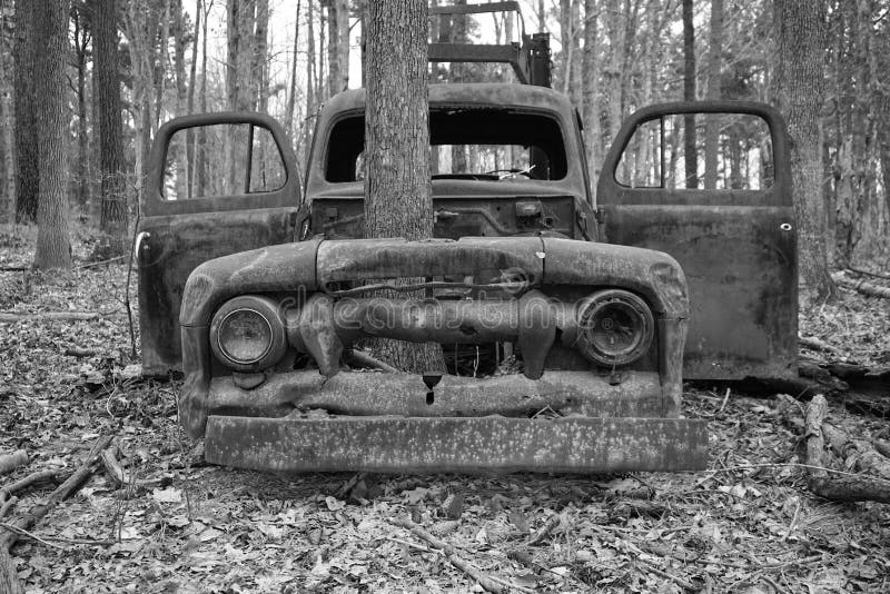 Old Rusty Abandoned Truck with a Tree Growing through the Engine ...