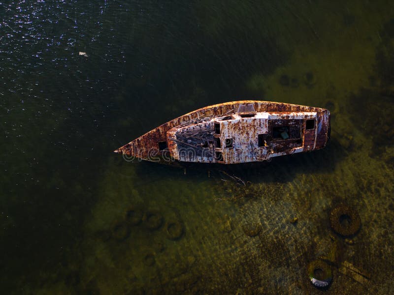 Old Rusty Abandoned Yacht on the Seashore Stock Photo - Image of sail ...