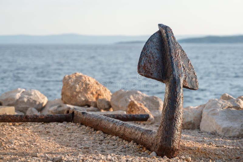 Old Rusty Anchor on the Beach with Stones Stock Image - Image of rust ...