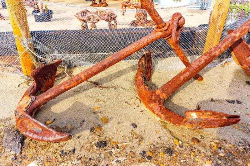 Old Rusty Anchors on the Beach Stock Photo - Image of seashore, anchor ...