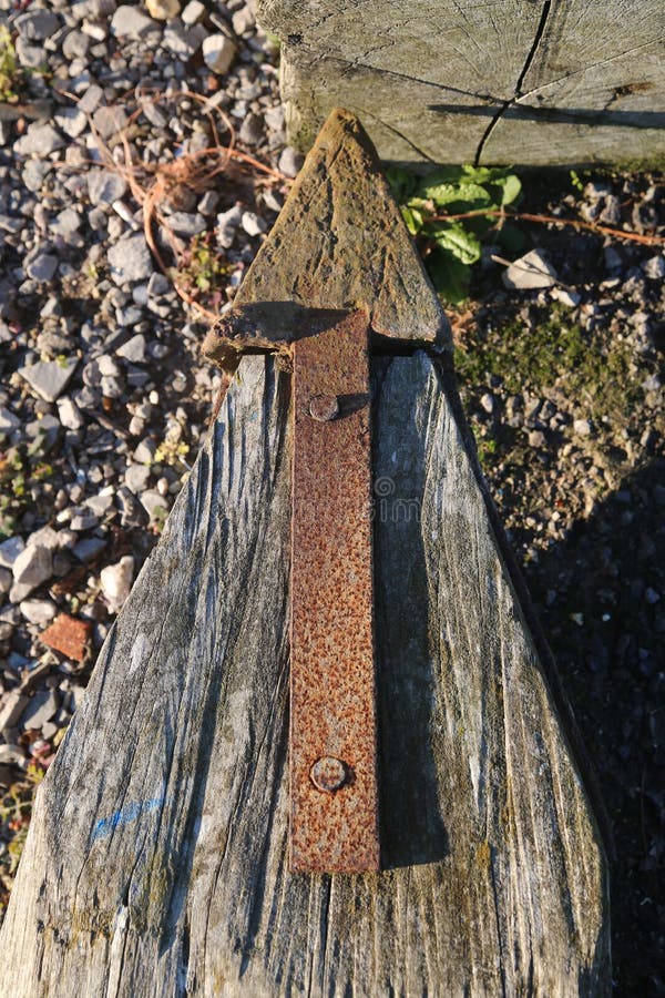 Old Rusty Arrow Attached To a Wooden Post Stock Photo - Image of rust ...
