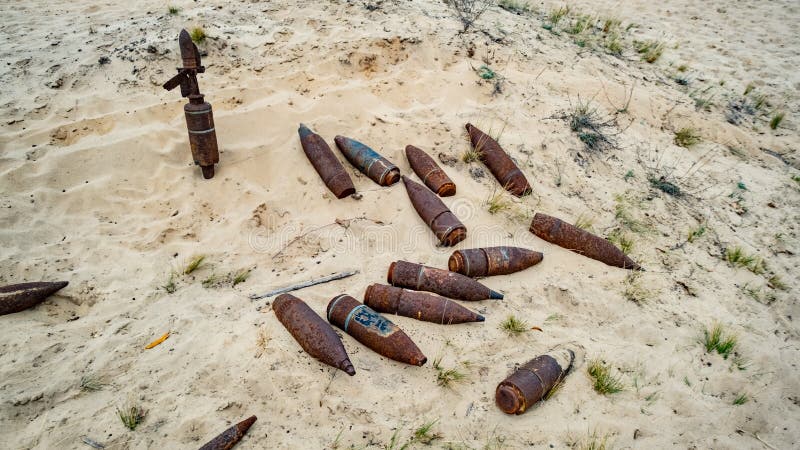 Old bombs in desert stock photo. Image of pile, rust - 165333224