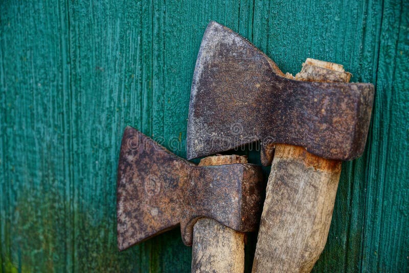 Two Old Axes on the Green House Wall Board Stock Image - Image of ...