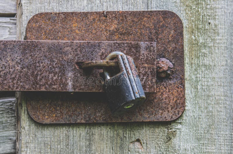 Old rusty barn padlock stock photo. Image of iron, ancient - 225339216