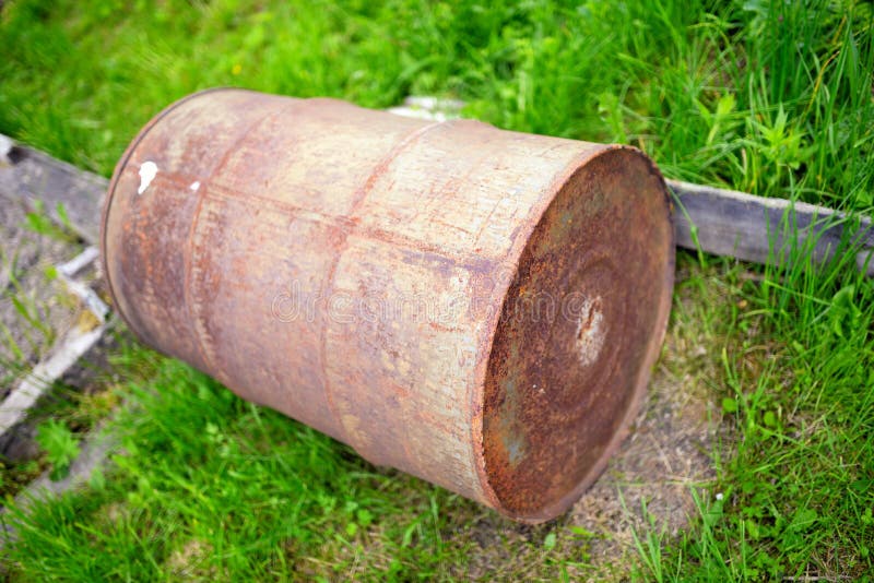 Old Rusty Barrel Against a Green Grass Stock Photo - Image of chemical ...