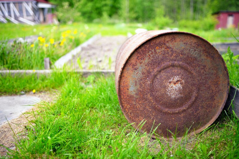 Old Rusty Barrel Against a Green Grass Stock Image - Image of ...