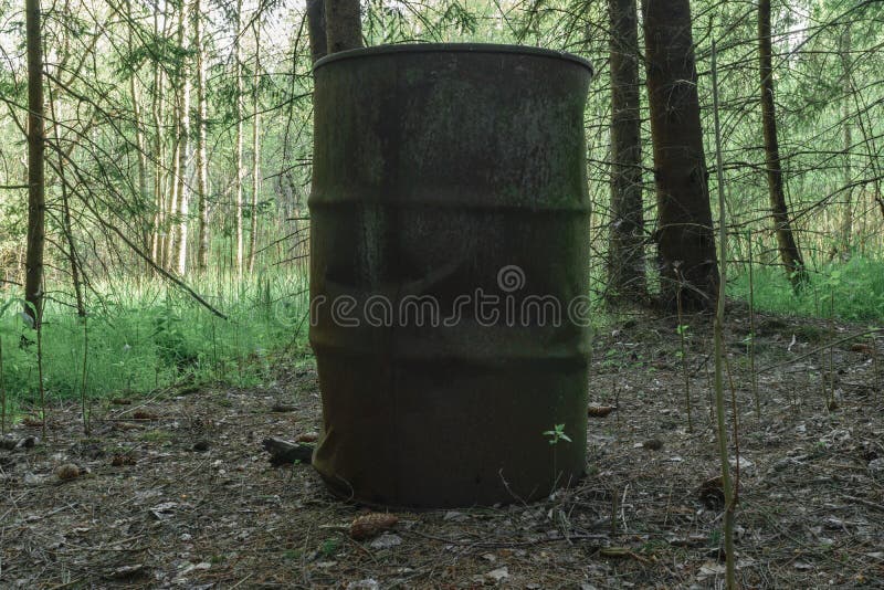 Rusty barrel in the forest stock image. Image of green - 152199043