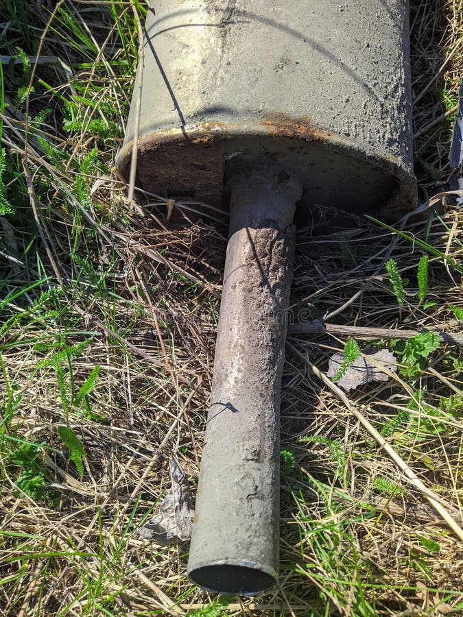 Old rusty car muffler. stock photo. Image of damage - 268481966