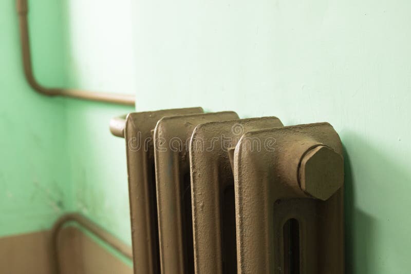 Old Rusty Battery on a Green Wall Stock Image - Image of iron, steel ...