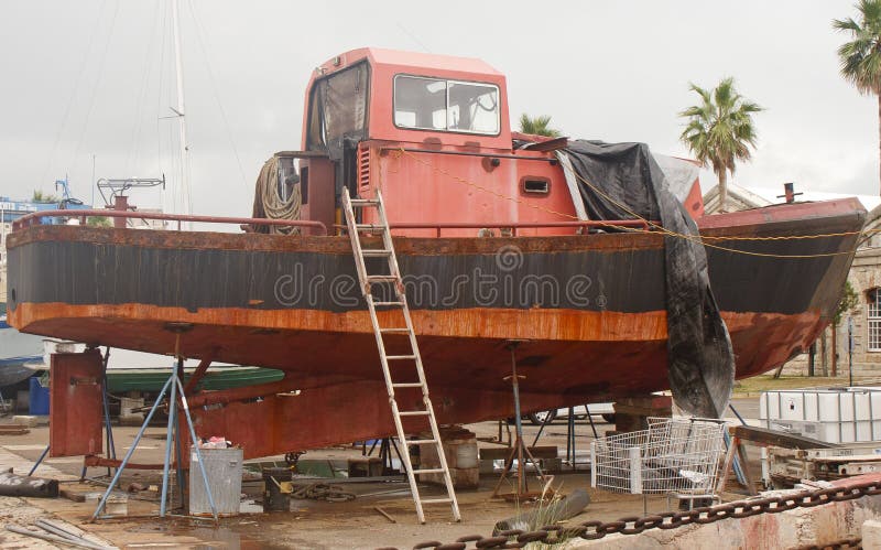 Old Rusty Boat in Dry Dock stock image. Image of fishing - 23624759