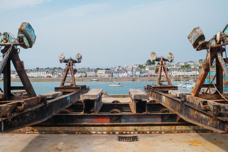 Old Rusty Boat in the Harbor with a Seascape and Buildings in the ...