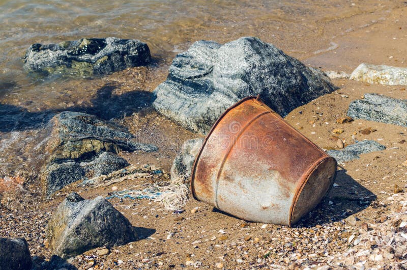 Old Rusty Bucket on a Sandy Beach Stock Image - Image of environmental ...