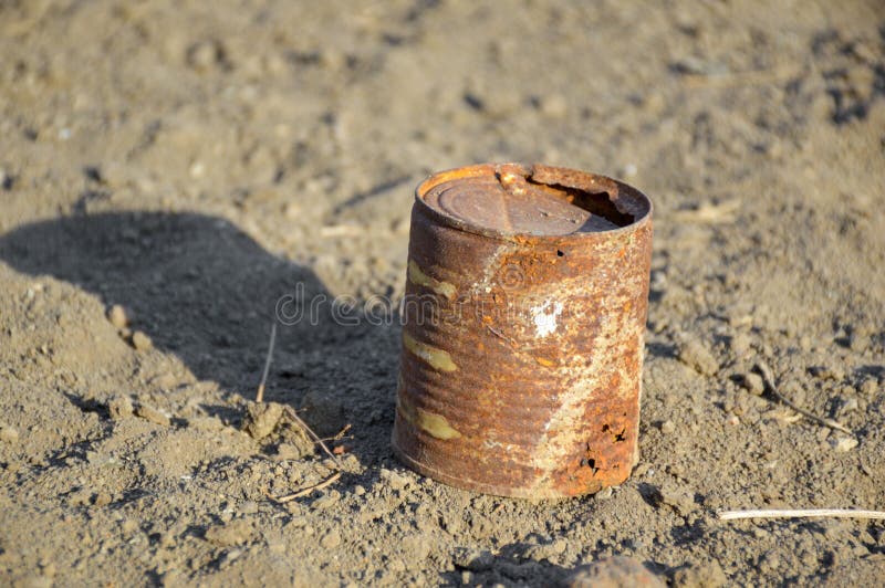 Old Rusty Can on the Ground Stock Image - Image of rusty, steel: 155985467