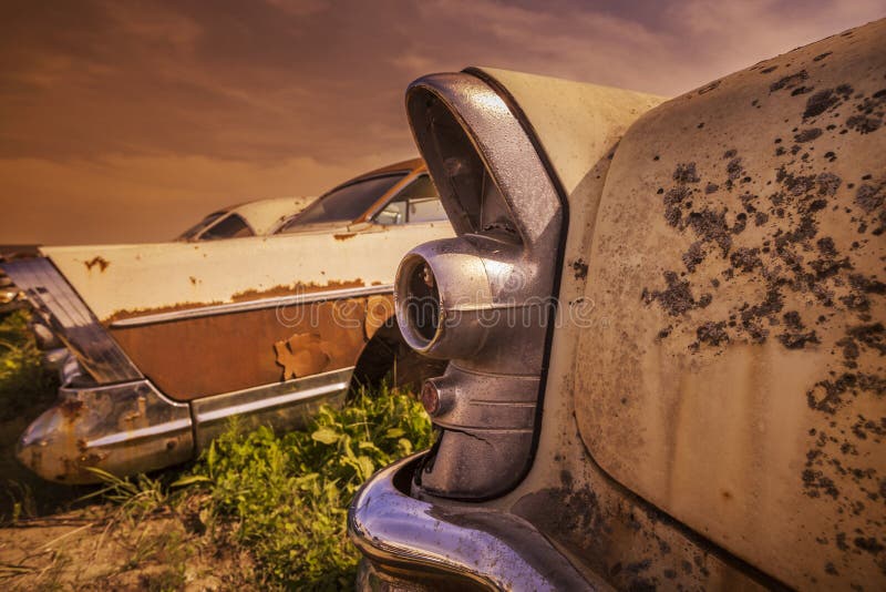 Two Old Rusty Cars with Dramatic Sky in Junk Yard Stock Photo - Image ...