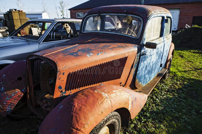 An Old Rusty Car in a Car Dump. Stock Image - Image of destroyed ...