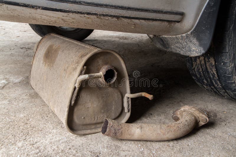 Old rusty car muffler. stock photo. Image of damage - 268481966