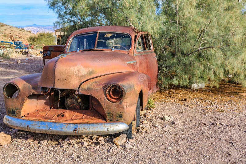 An Old, Rusty Car is Sitting in a Desert Stock Image - Image of ...