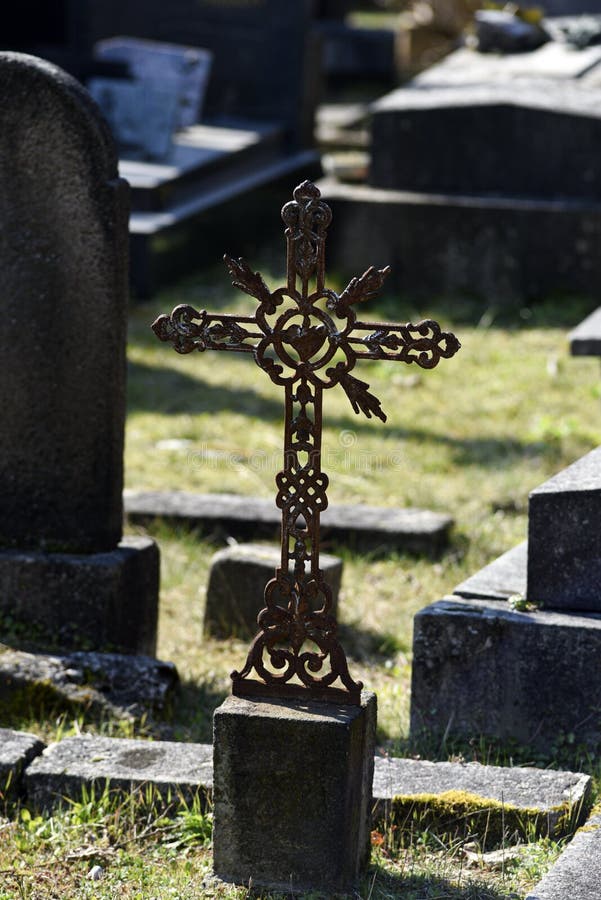 An Old Rusty Catholic Cross in a Cemetery in France Stock Photo - Image ...