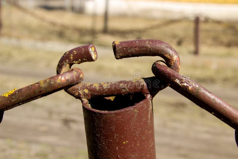 Fastening the Chain with a Large Bolt. at the End of the Chain is an ...