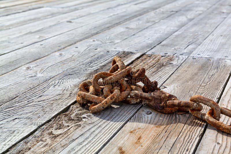 Old Rusty Chain on a Wood Dock Stock Photo - Image of shackle, chain ...