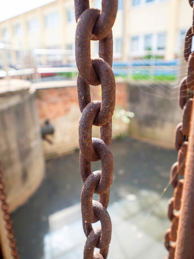 Old Rusty Chained and Wheels. Cogs Control the Floodgates Stock Photo ...