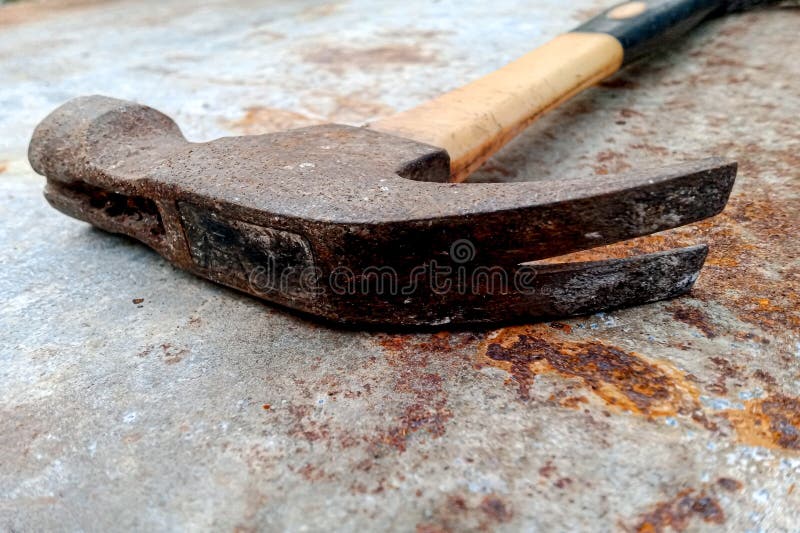 Old Rusty Claw Hammer on Metal Surface. Outdated Tool for Construction ...