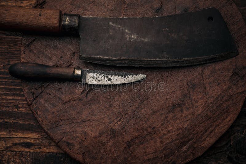 Old Rusty Cleaver and Little Utility Knife on Top of Rustic Cutting ...