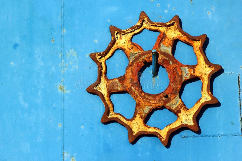 Old Rusty Cogwheel Hanging on Blue Metal Wall Background Stock Image ...