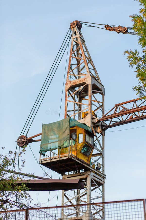 Old Rusty Construction Crane at a Construction Site Stock Image - Image ...