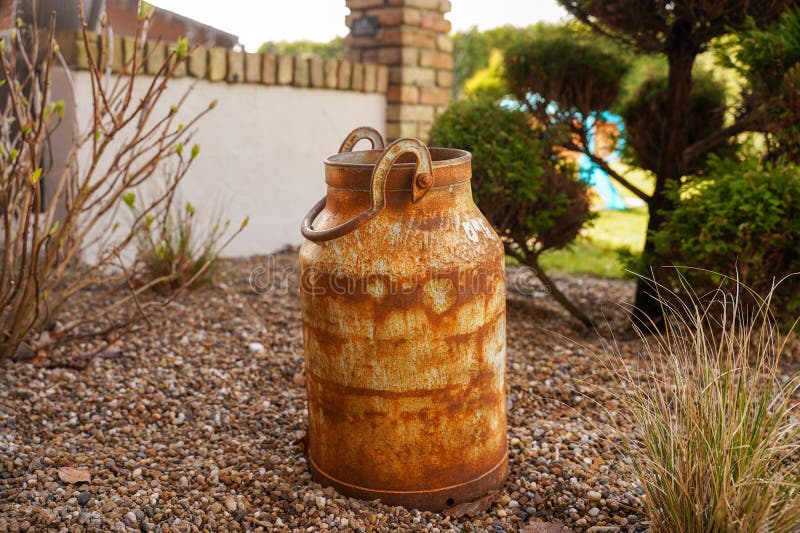 An Old Rusty Container in the Garden. Reuse of Old Things. an Old Can ...