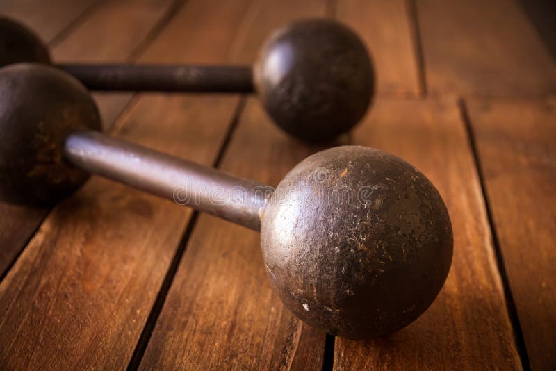 Old Rusty Dumbbells on Wood Background Texture Stock Image - Image of ...