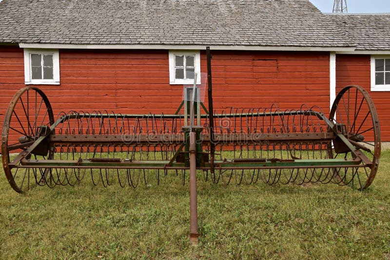 Old Rusty Dump Rake and Red Shed Stock Image - Image of round, white ...