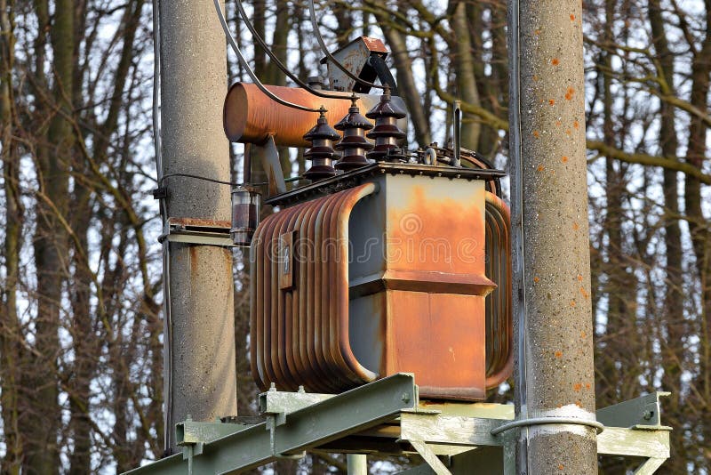 Old Rusty Electric Transformer on Two Concrete Pille, Electric Site ...