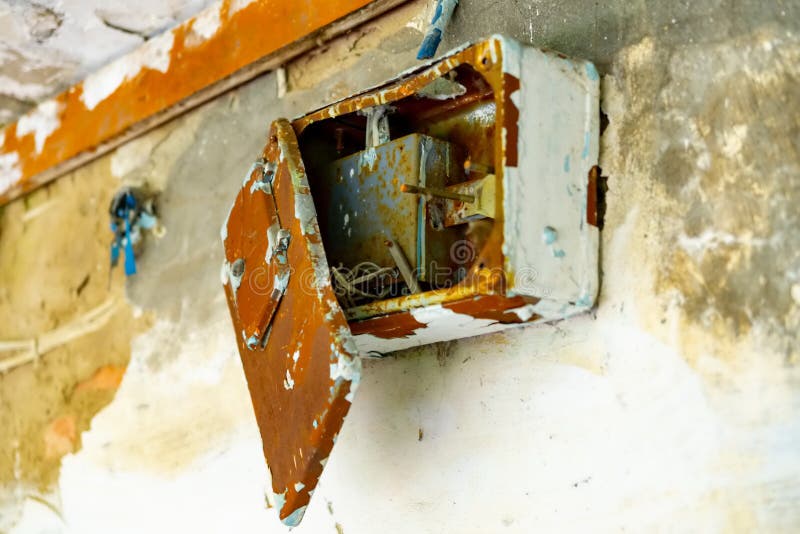 An Old Rusty Electrical Panel on the Wall of the House. a Panel on the ...