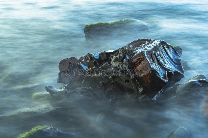 Old Rusty Engine Lying among Stones in the Water Stock Photo - Image of ...