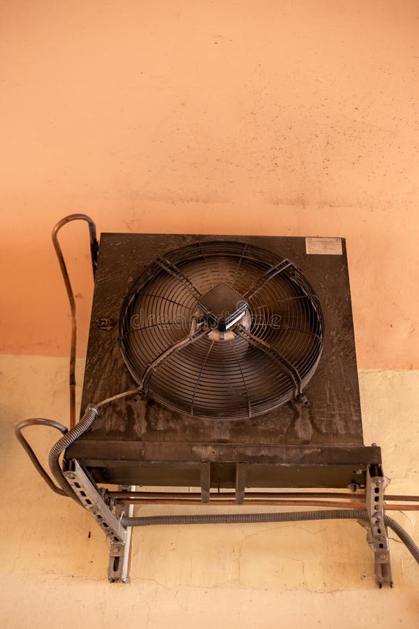 Old Rusty Fan on the Wall of a Building Stock Image - Image of ...
