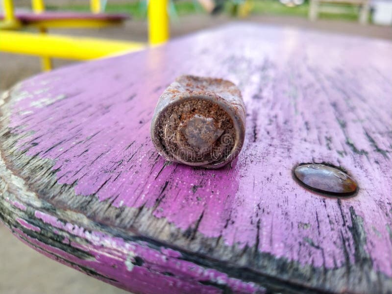 Old Rusty and Flattened Battery on Blurry Background Stock Photo ...