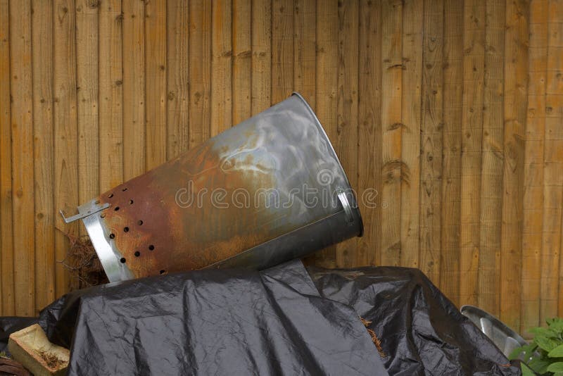 Old Rusty Garden Bin on Heap of Plastic Stock Photo - Image of cast ...