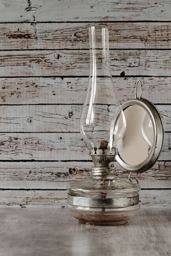 Old Rusty Gas Lamp Lit on Vintage Table Stock Image - Image of ...